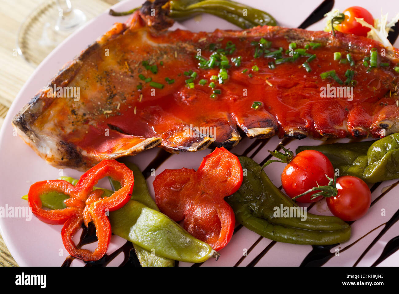 Delicious lamb ribs baked with spicy tomato sauce served with chilli ...