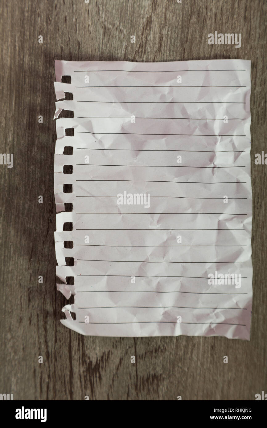 Crumpled sheet notebook line on table Stock Photo - Alamy
