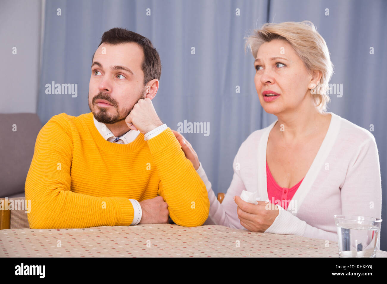 Aged mother arguing with her adult son at home Stock Photo - Alamy