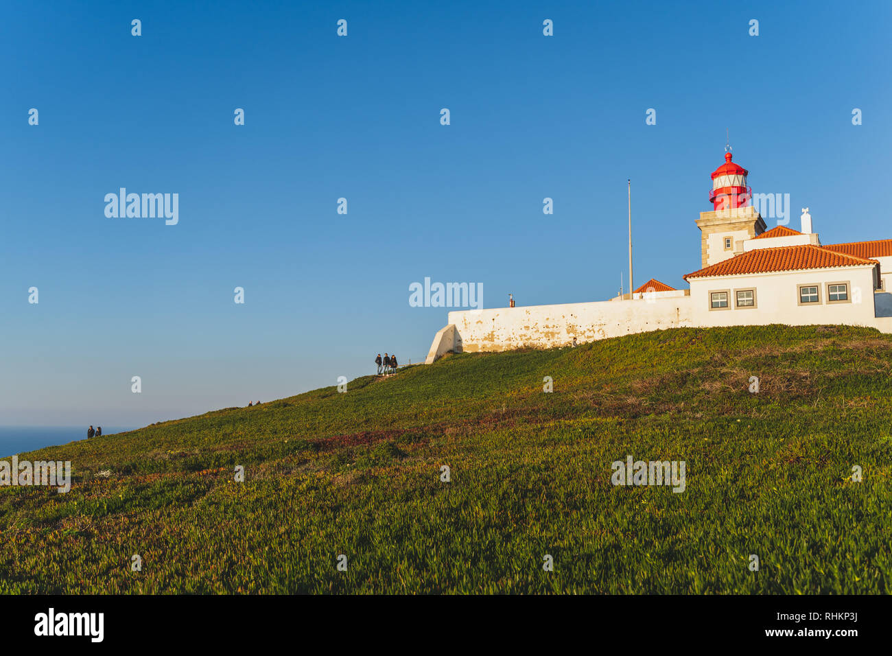 Cape Roca lighthouse (Cabo da Roca) Green grass, blue sky and atlantic ...