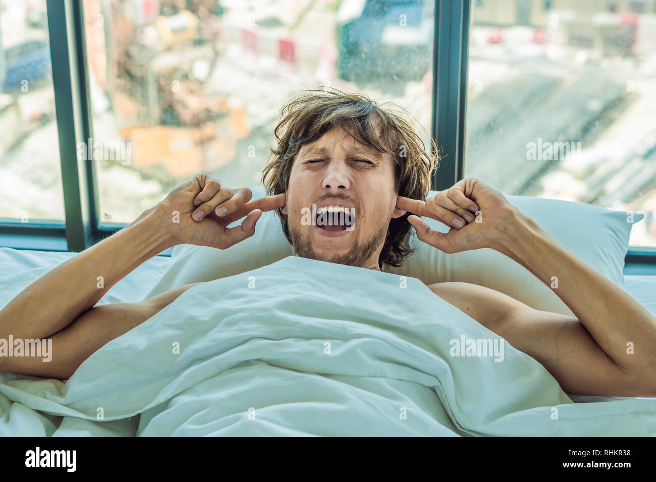 Screaming man hands in ears hi-res stock photography and images - Alamy