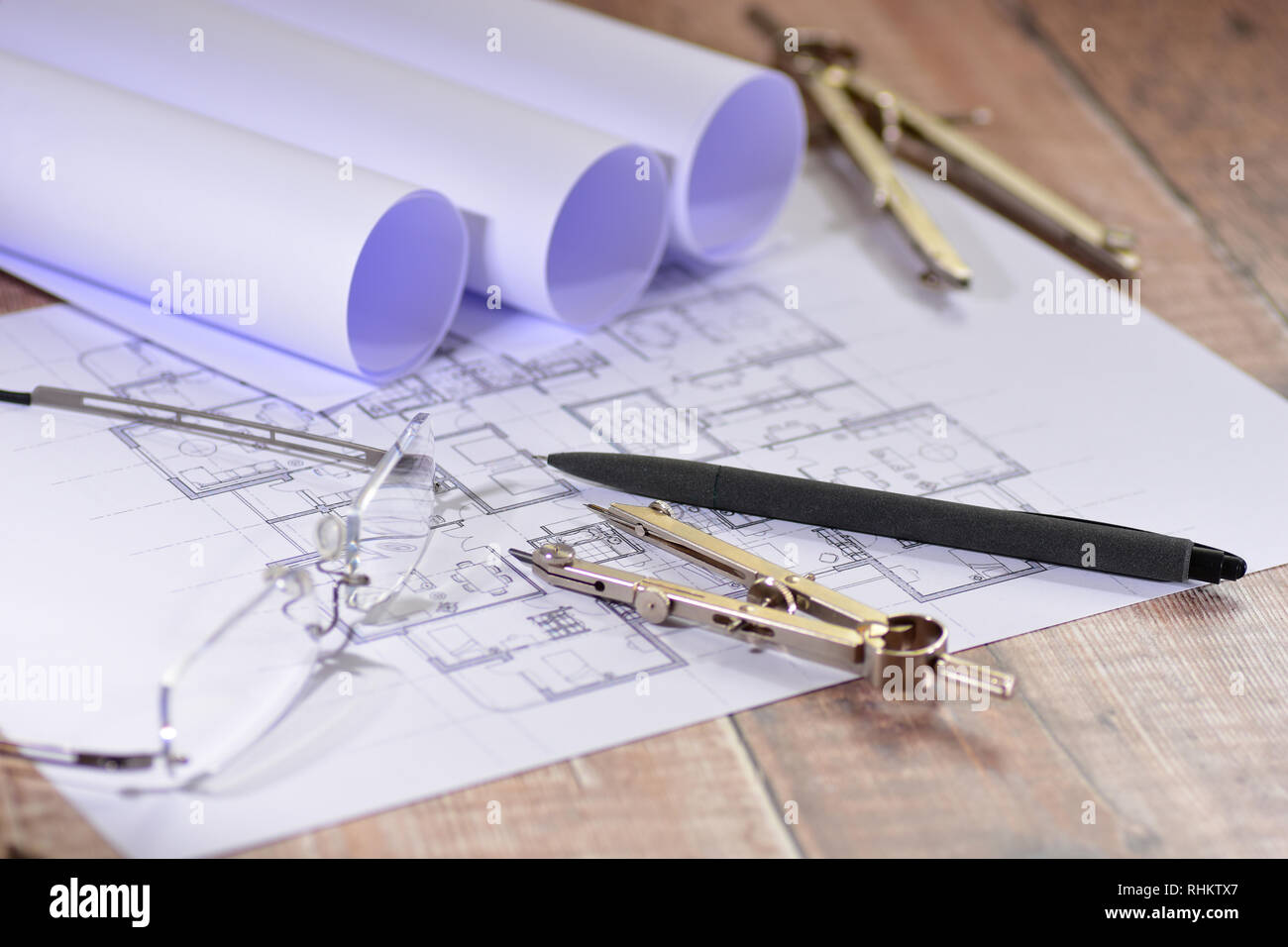Architects drawings on a wooden table Stock Photo - Alamy