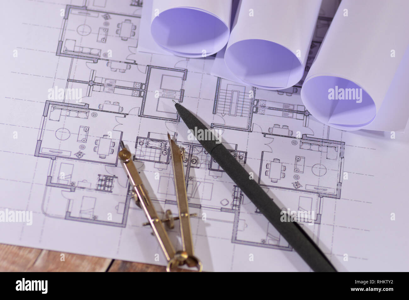 Architects drawings on a wooden table Stock Photo - Alamy