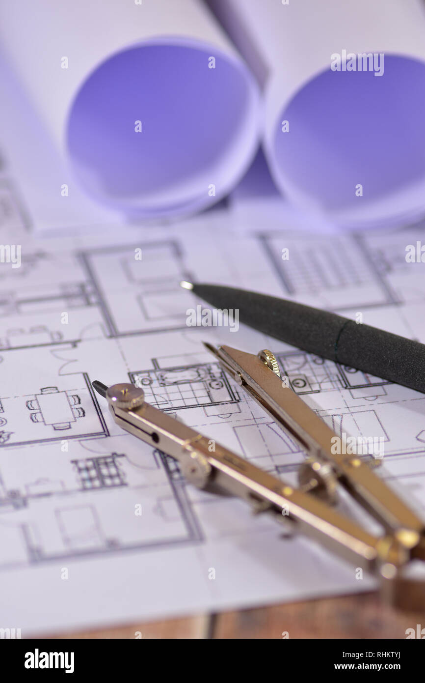 Architects drawings on a wooden table Stock Photo - Alamy