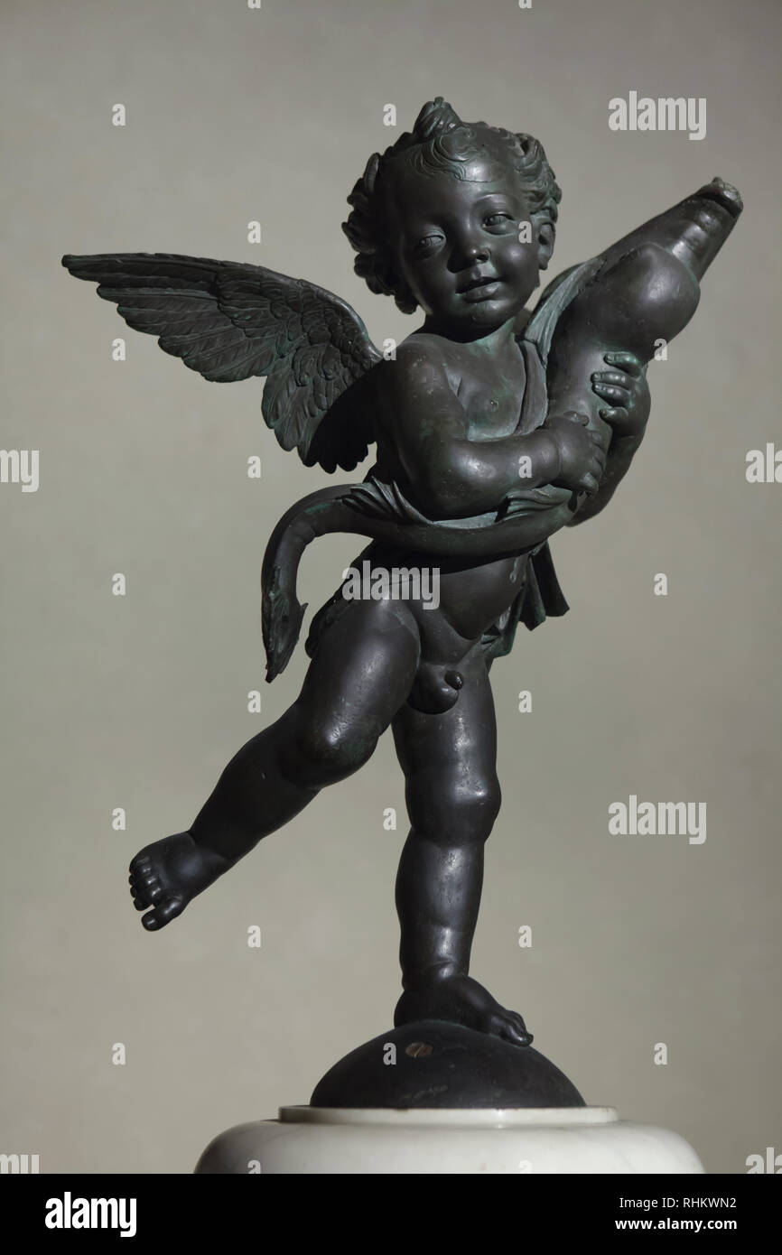 Dolphin and boy statue hi-res stock photography and images - Alamy