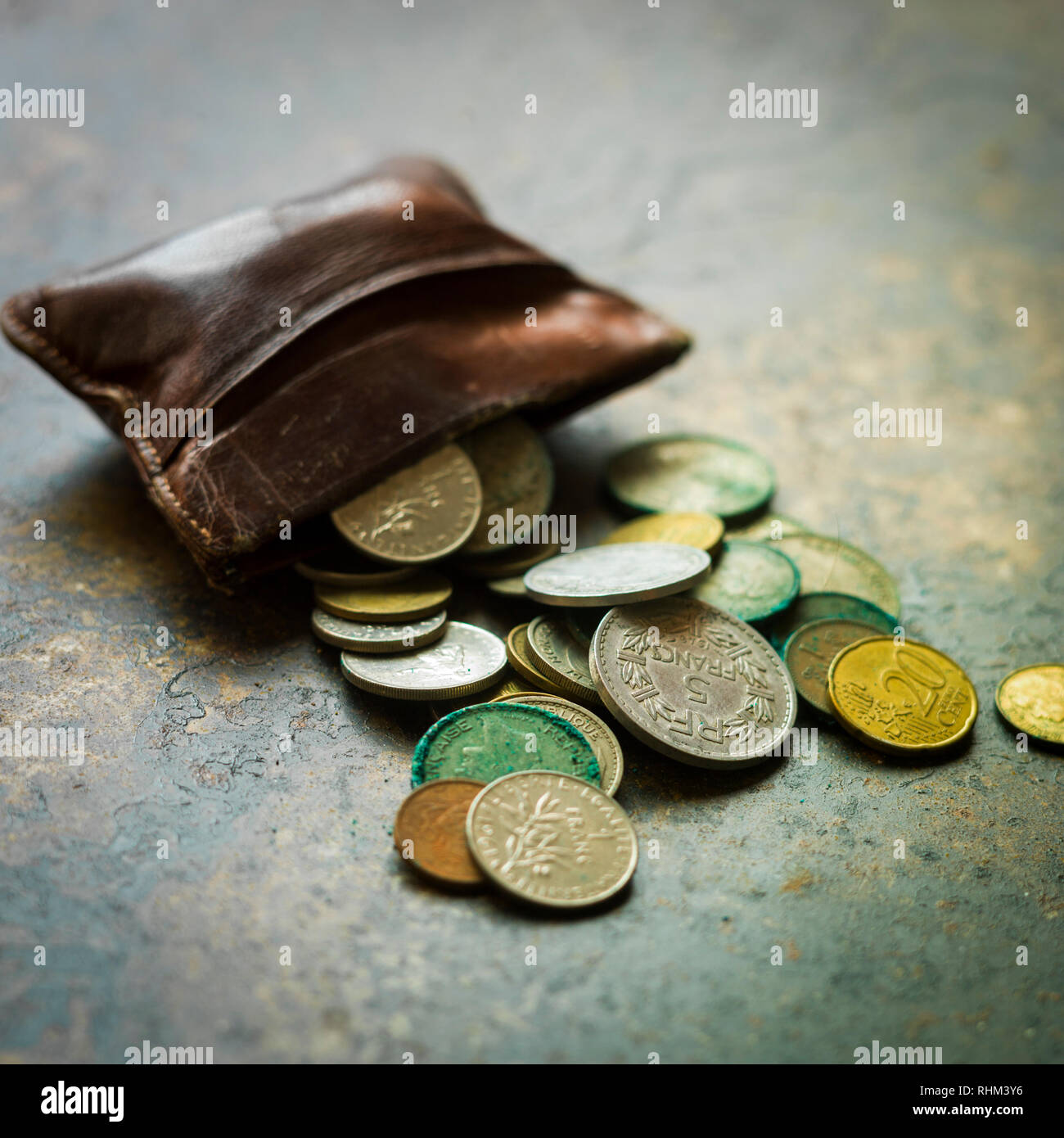 Wallet and coins Stock Photo - Alamy