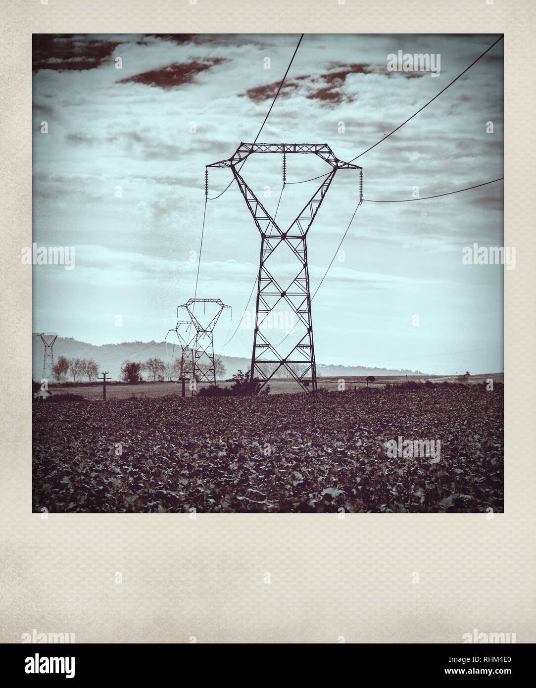 Polaroid photograph of power lines through fields hi-res stock ...