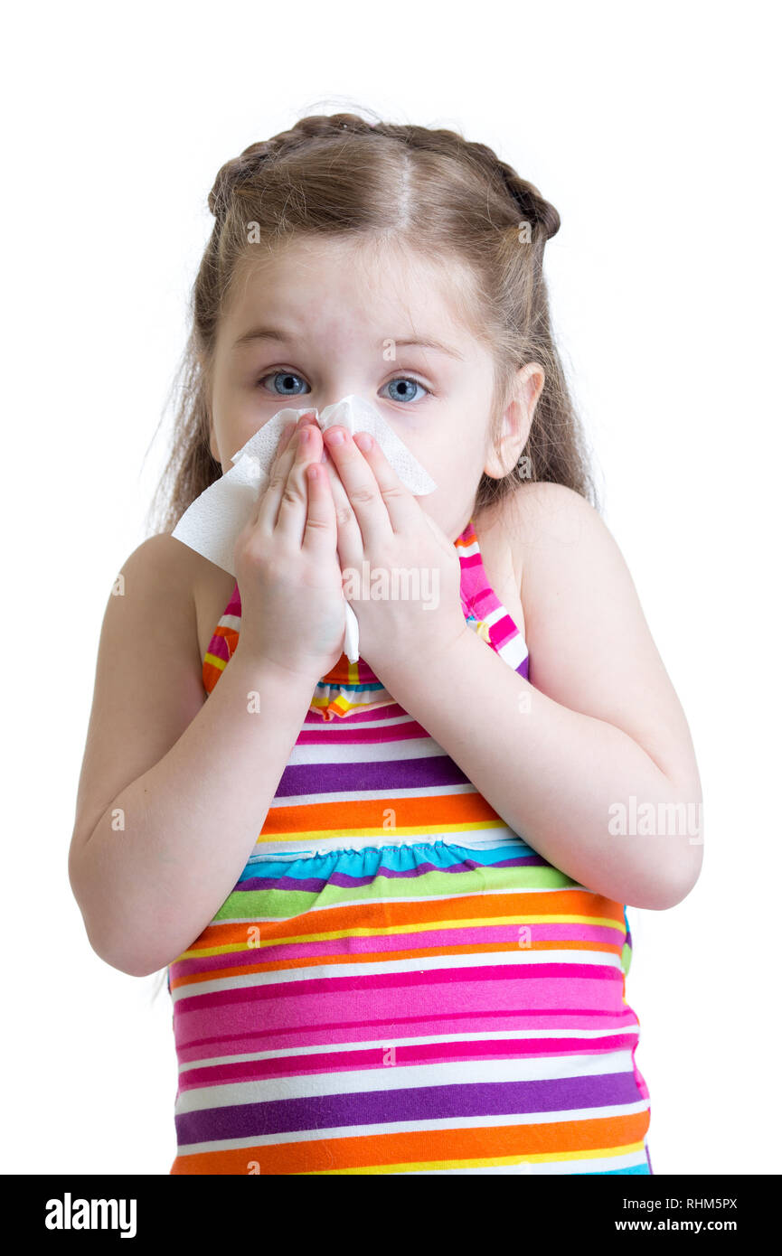 Child girl blowing her nose into a handkerchief isolated on a white ...