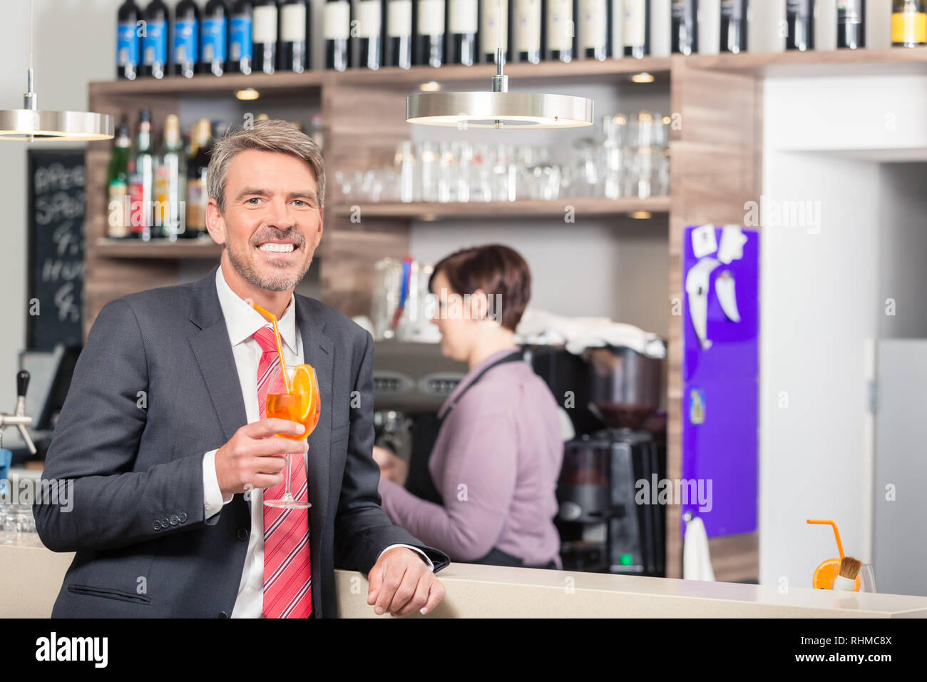 Man straw orange juice hi-res stock photography and images - Alamy