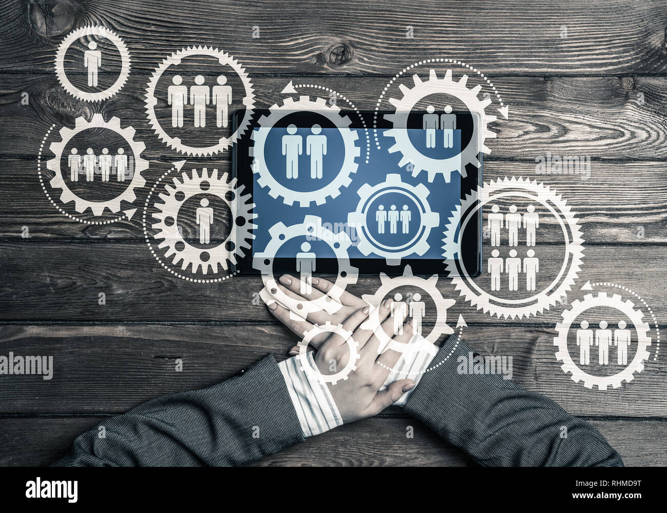 Concept of teamworking and connection with gears mechanism and tablet ...