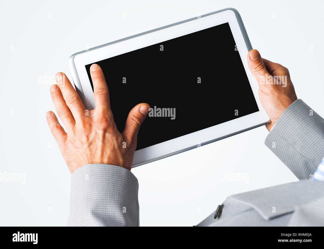 Hands of businessman holding tablet pc with black screen Stock Photo ...