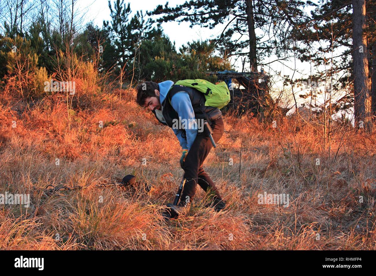 look for hidden treasures with the metal detector Stock Photo - Alamy