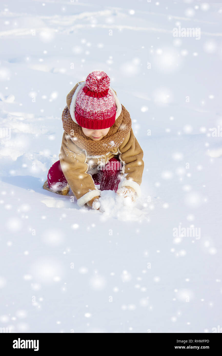 Small child plays in winter hi-res stock photography and images - Alamy