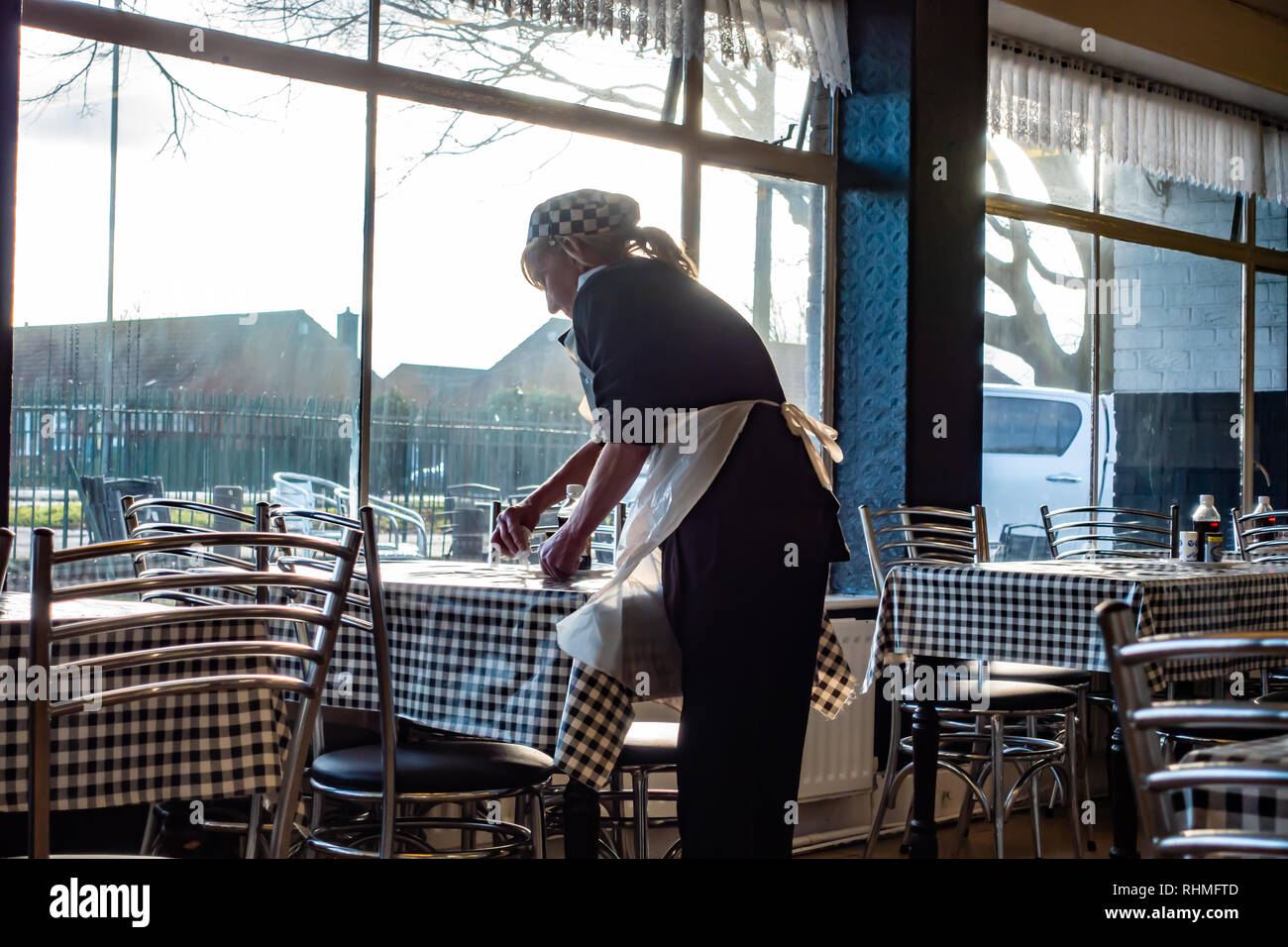 Waitress cleans tables hi-res stock photography and images - Alamy