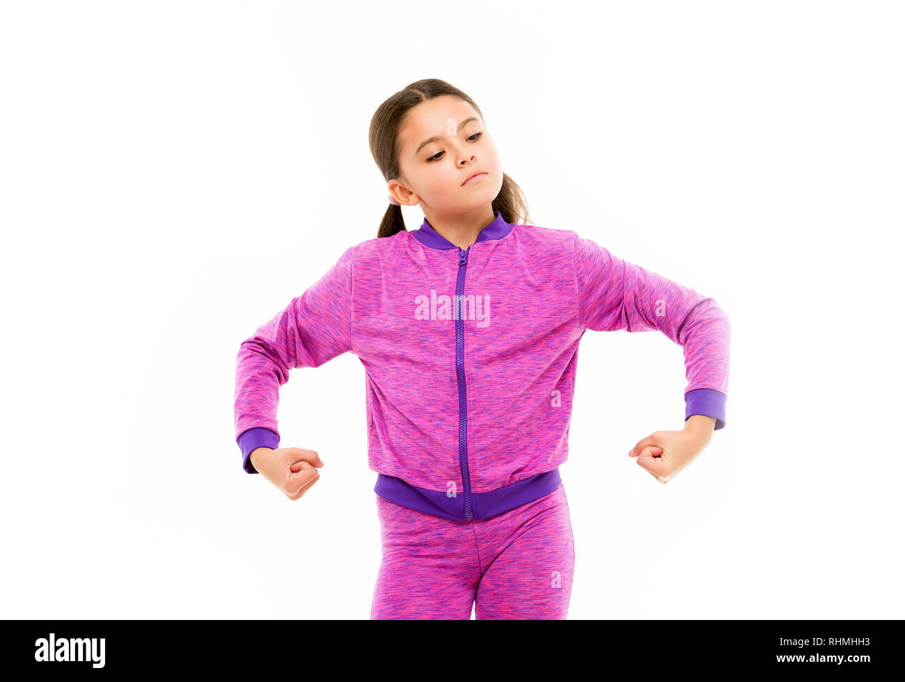 Feel so strong. Child cute girl show biceps gesture of power and ...