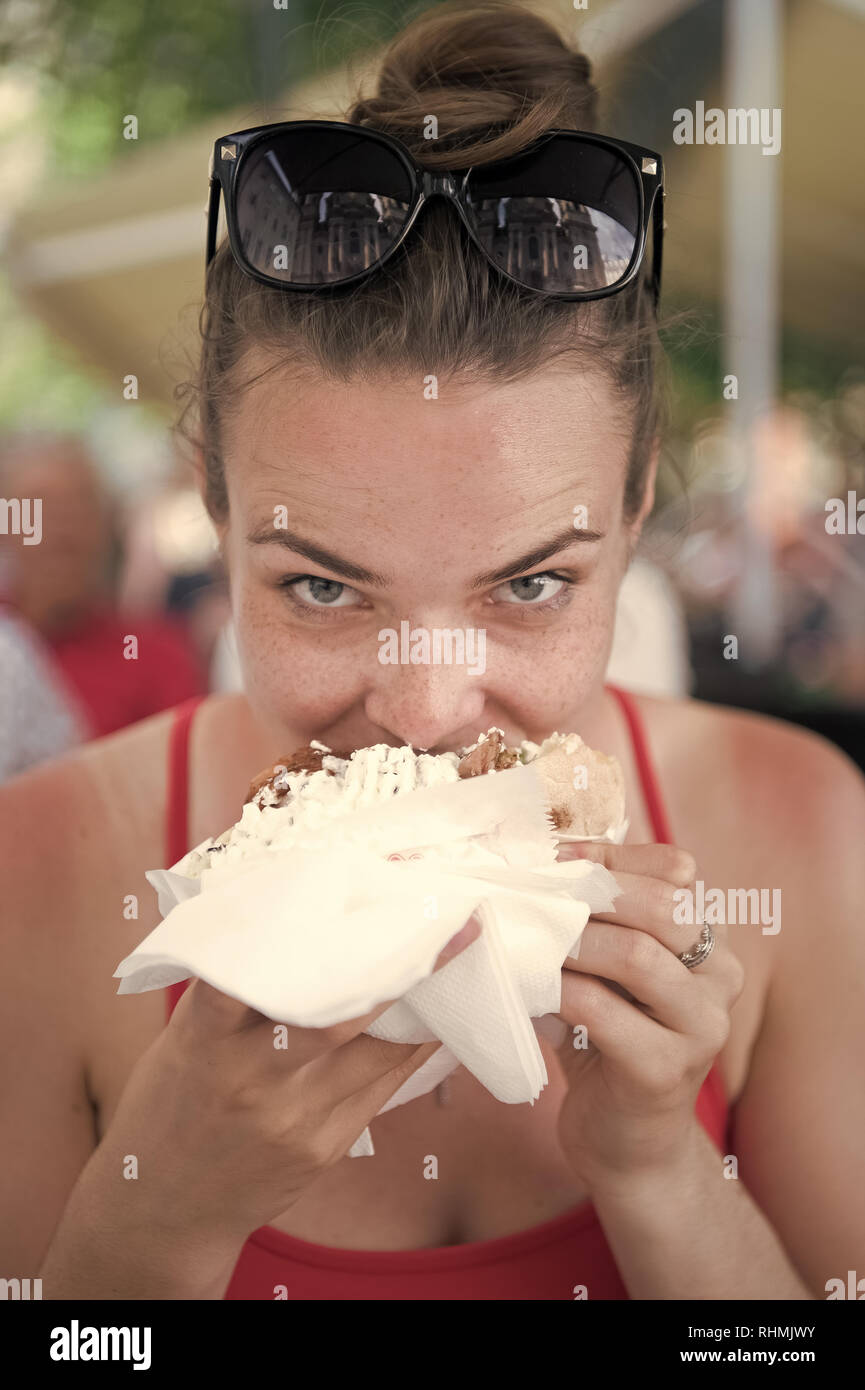 pretty girl or Woman eating sandwich gyros. Girl with pleasure eats ...