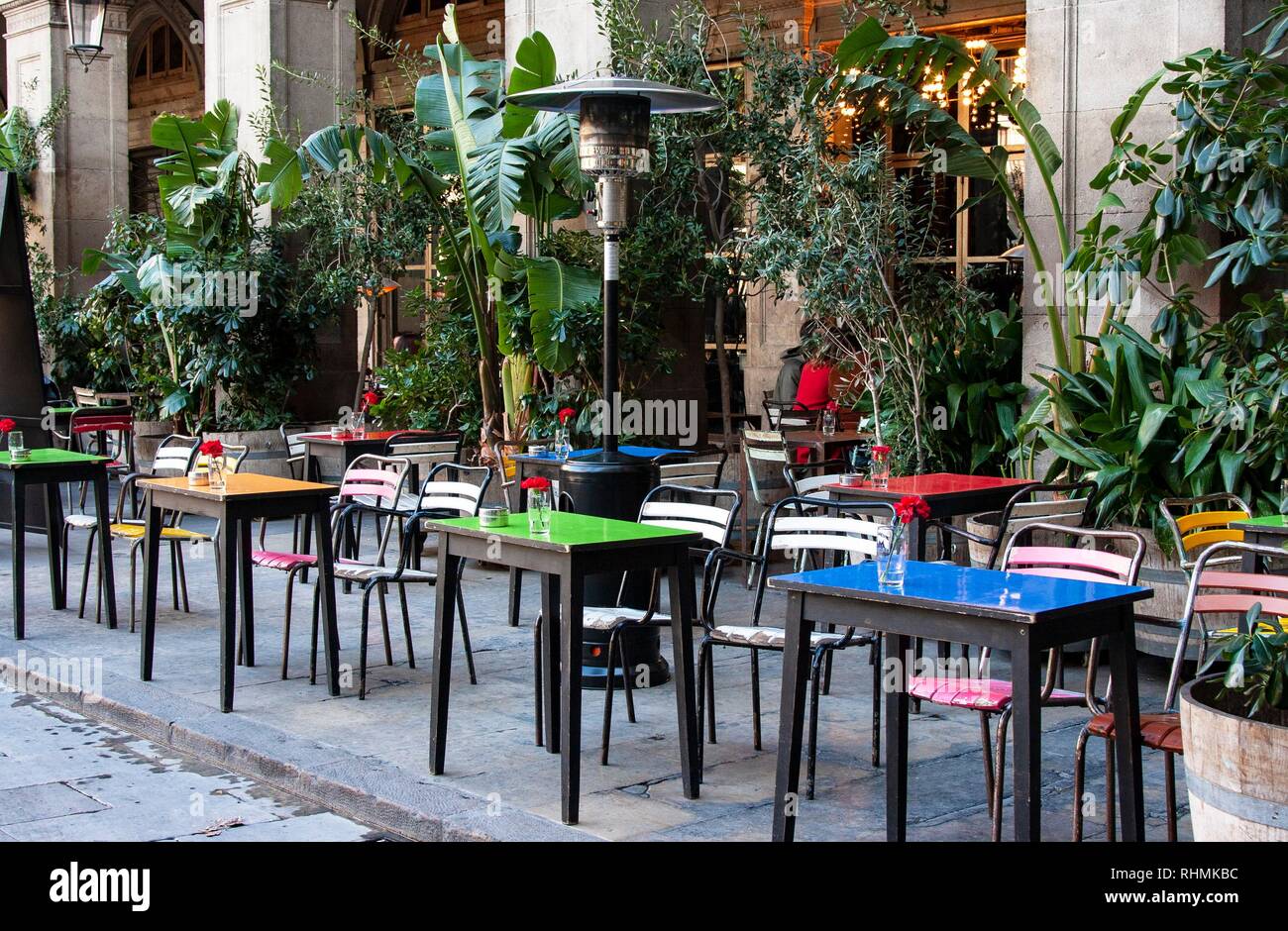 Street cafe with colorful tables and chairs in Barcelona, Spain Stock ...