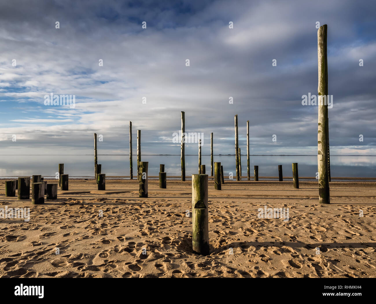 Poles on the marina beach in Hjerting in Esbjerg, Denmark Stock Photo ...