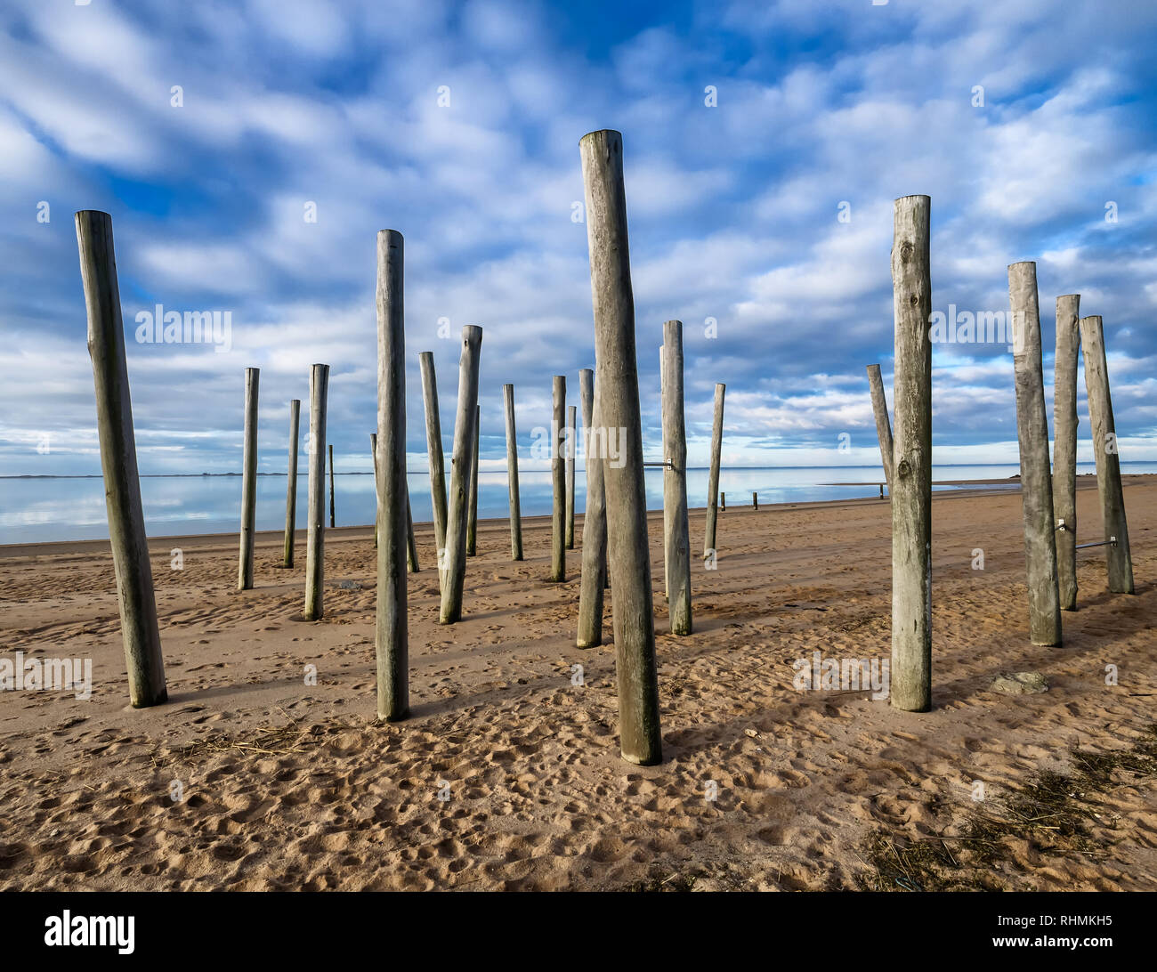 Poles on the marina beach in Hjerting in Esbjerg, Denmark Stock Photo ...