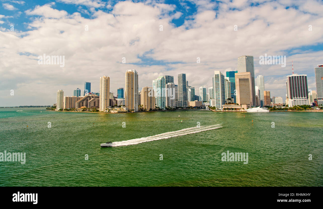 miami skyline. luxury Yachts sail on sea or ocean water to city ...