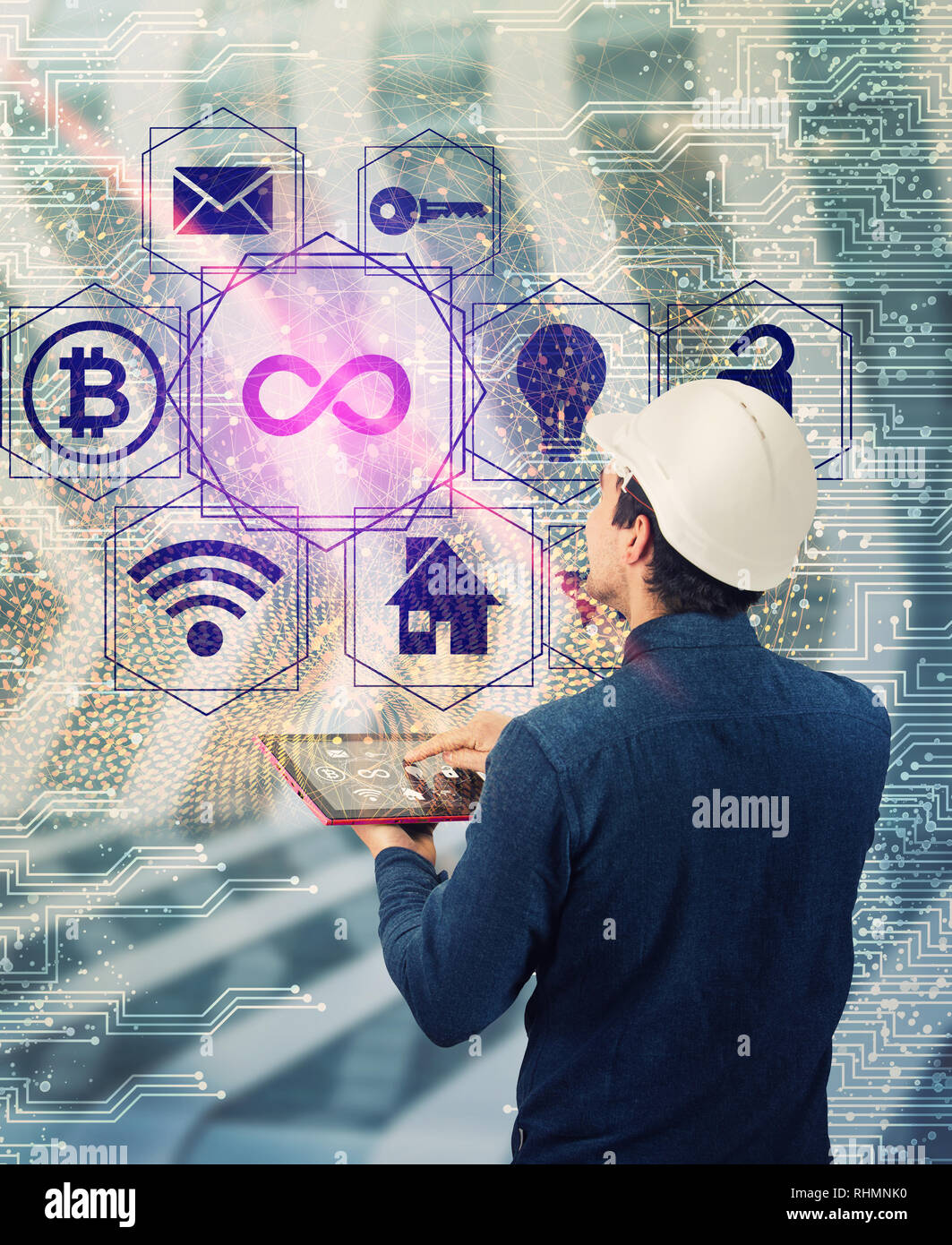 Rear view engineer wearing protective helmet using tablet computer ...