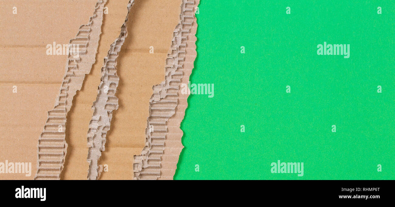 Brown corrugated cardboard ragged edge frame on green background Stock ...