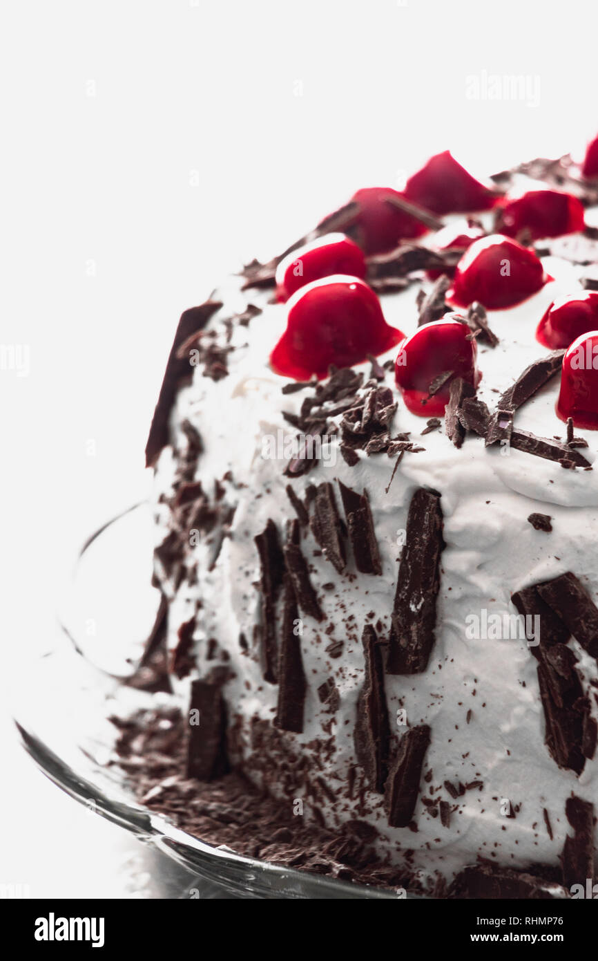 Black Forest Cake close-up. White background - Red cherries, chocolate ...
