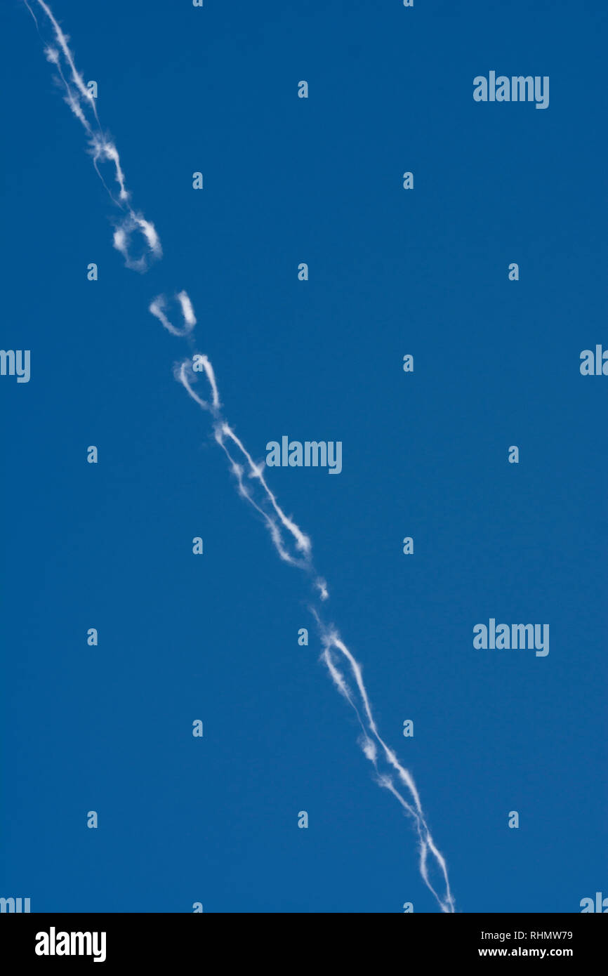 An unusual aircraft contrail Stock Photo - Alamy