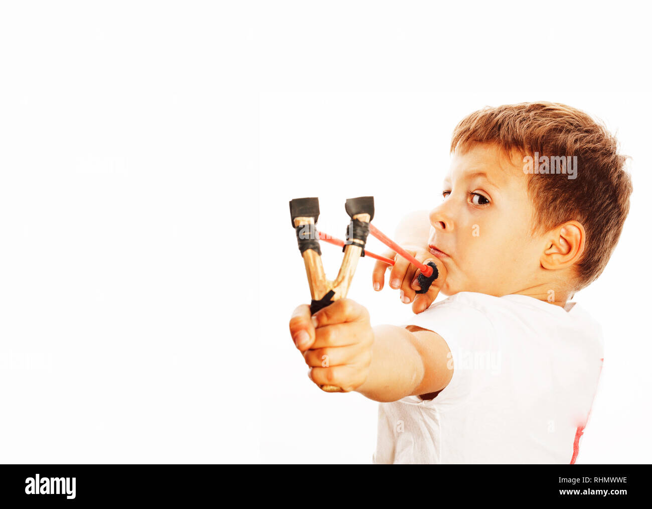 little cute angry real boy with slingshot isolated Stock Photo - Alamy