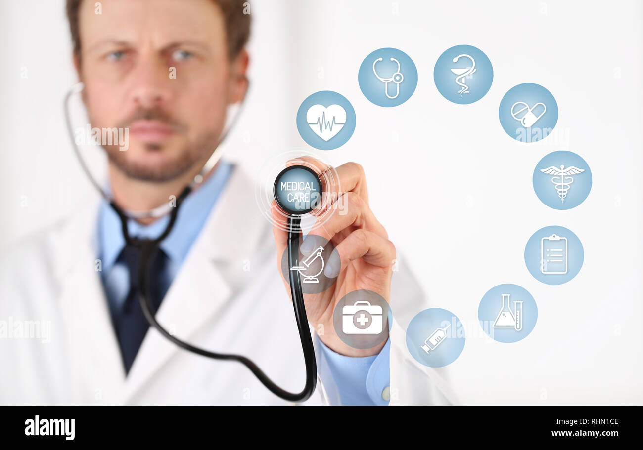 Doctor hand with a stethoscope touch screen with blue medical symbols ...