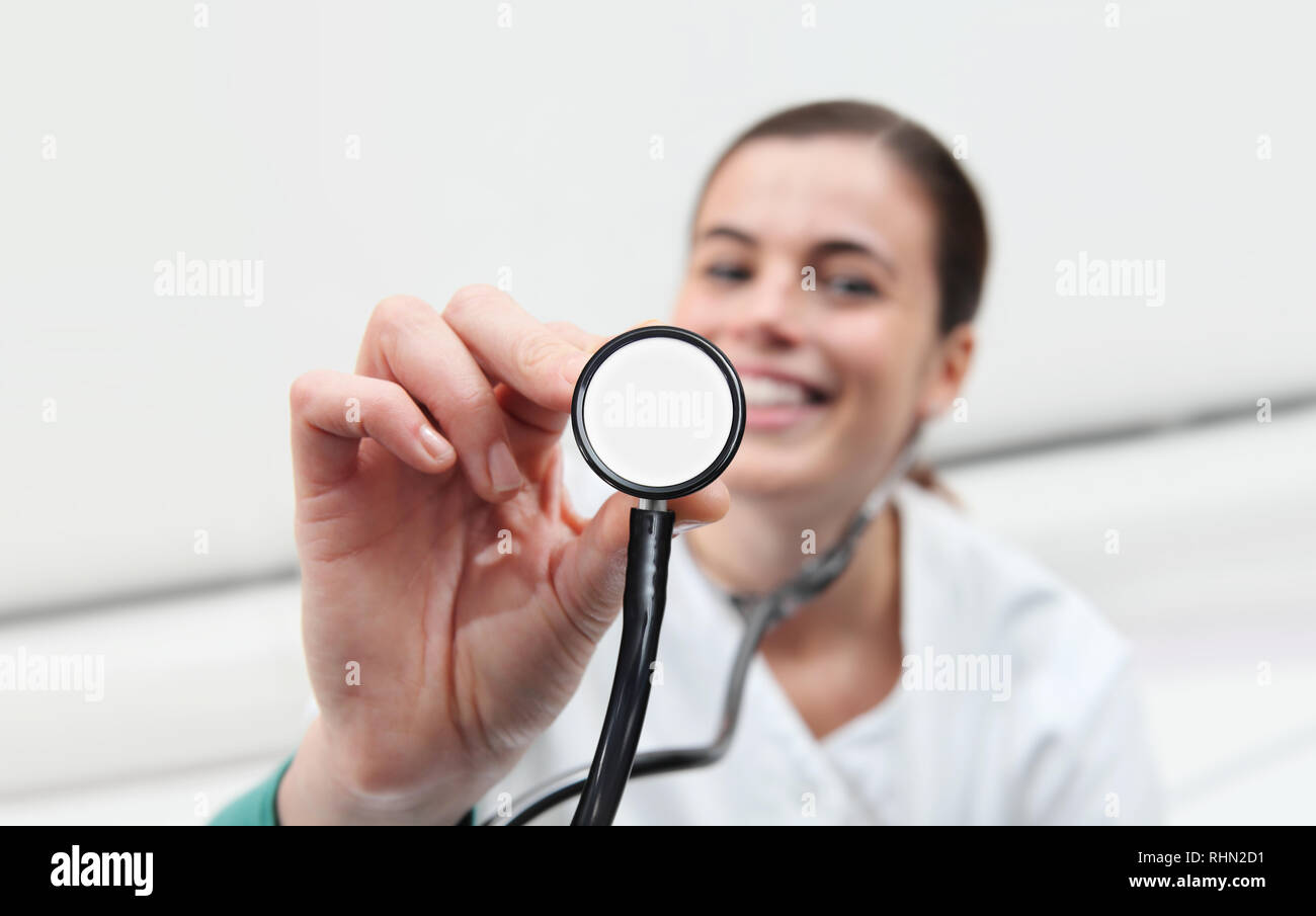 smiling woman doctor with stethoscope touch screen close up, diagnosis ...