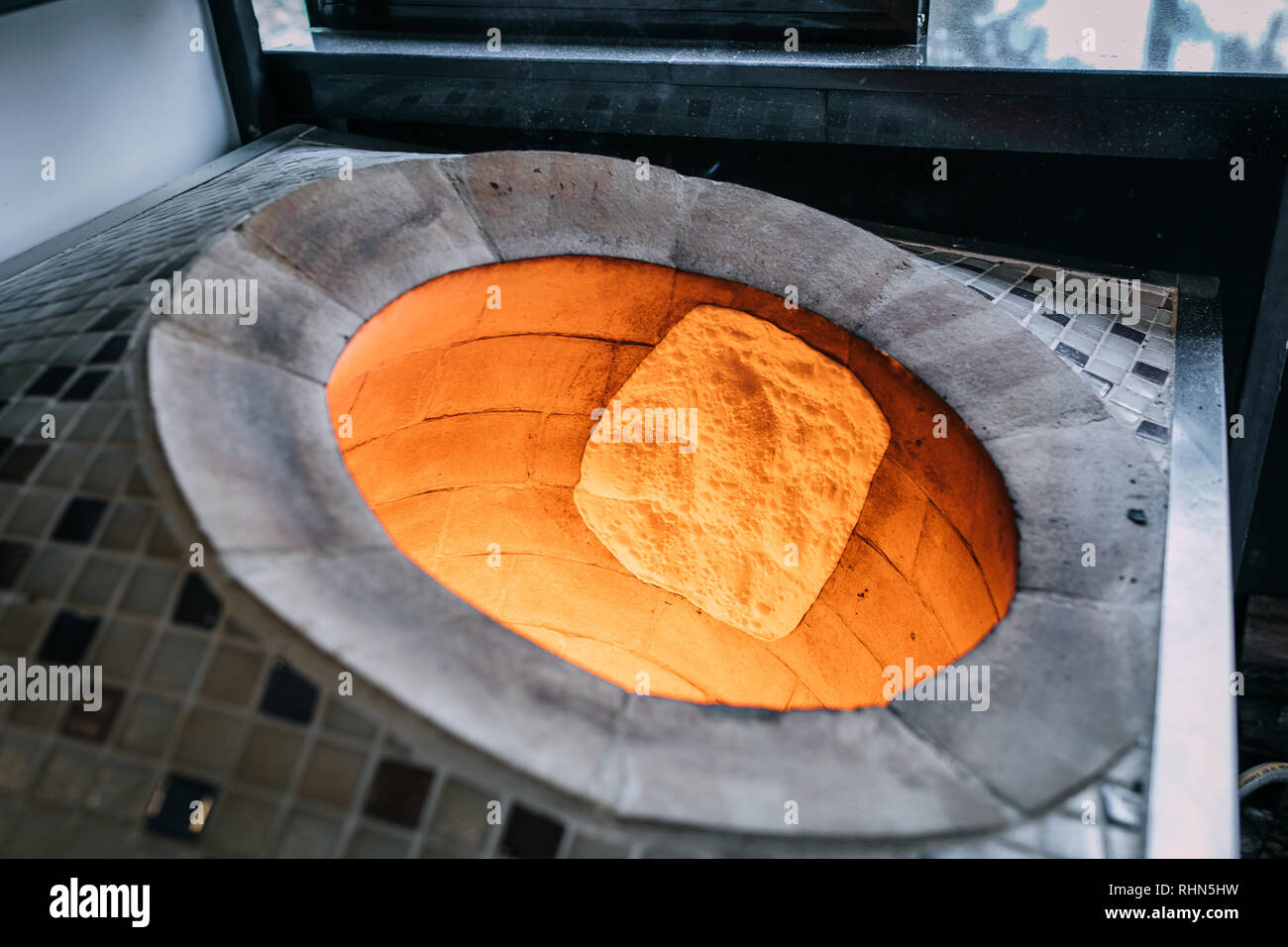 Traditional turkish wood fired stone brick oven and pita or pide bread ...