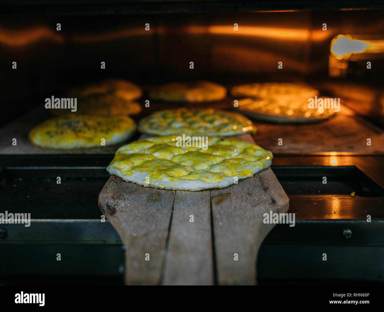 Traditional turkish Pita or pide bread in oven or stove. Bakery or ...