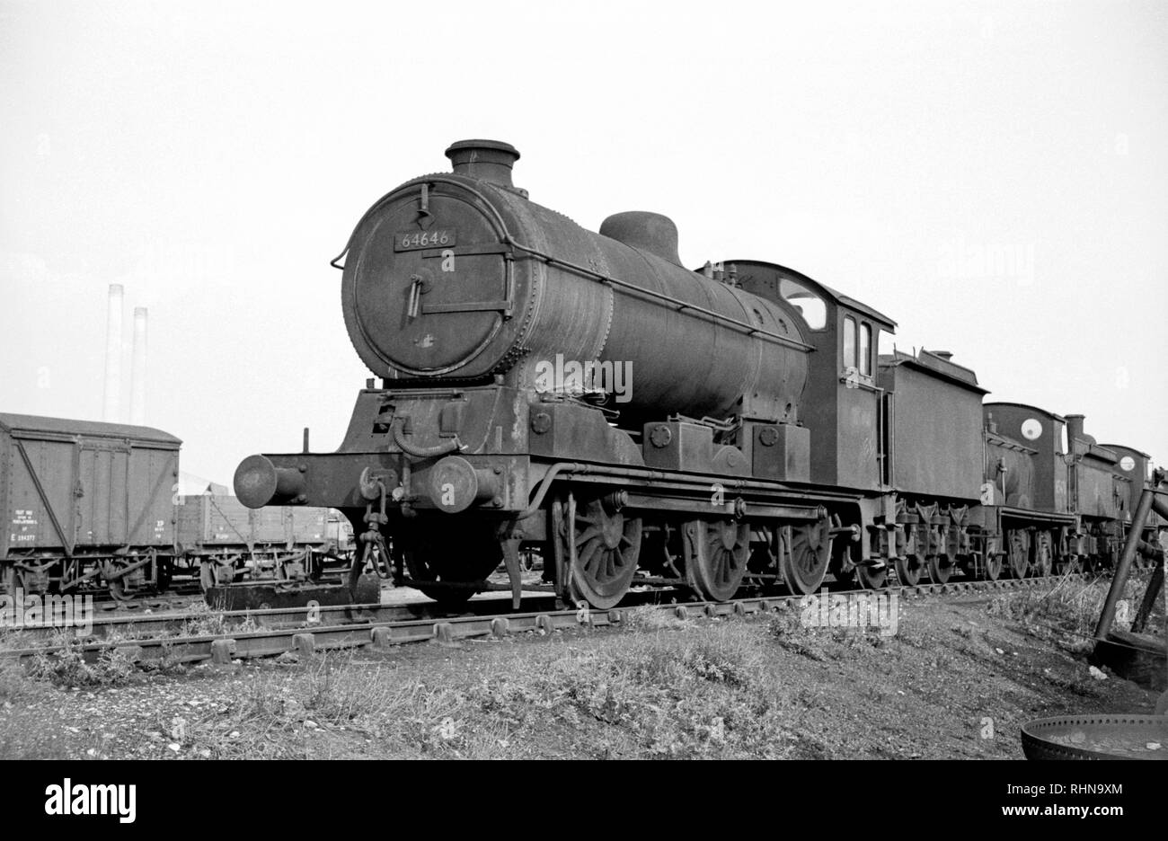 Steam engine number 64646 in sidings with other locomotives in the late ...