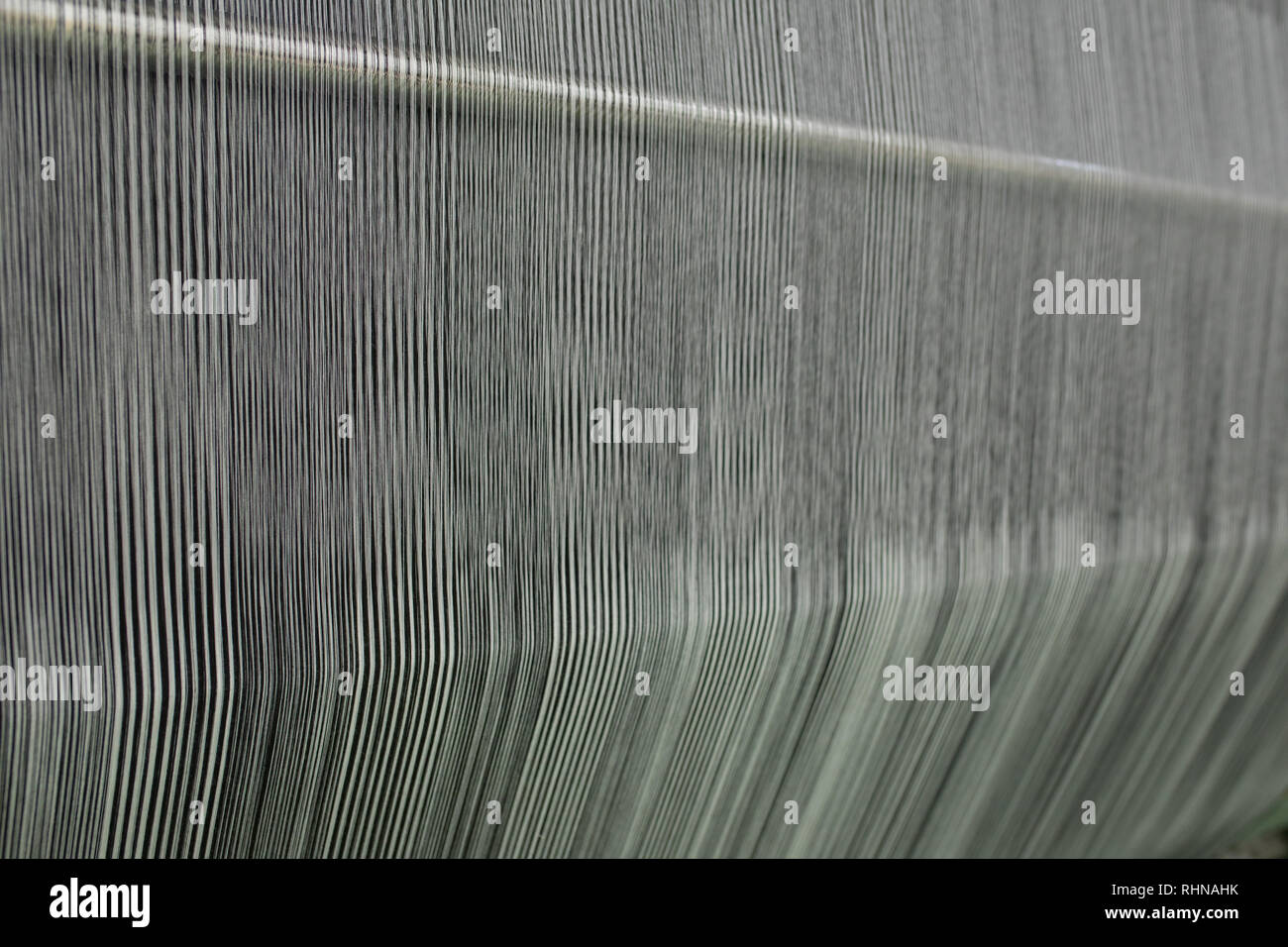 Yarn thread lines on the weaving loom machine. A loom machine for ...