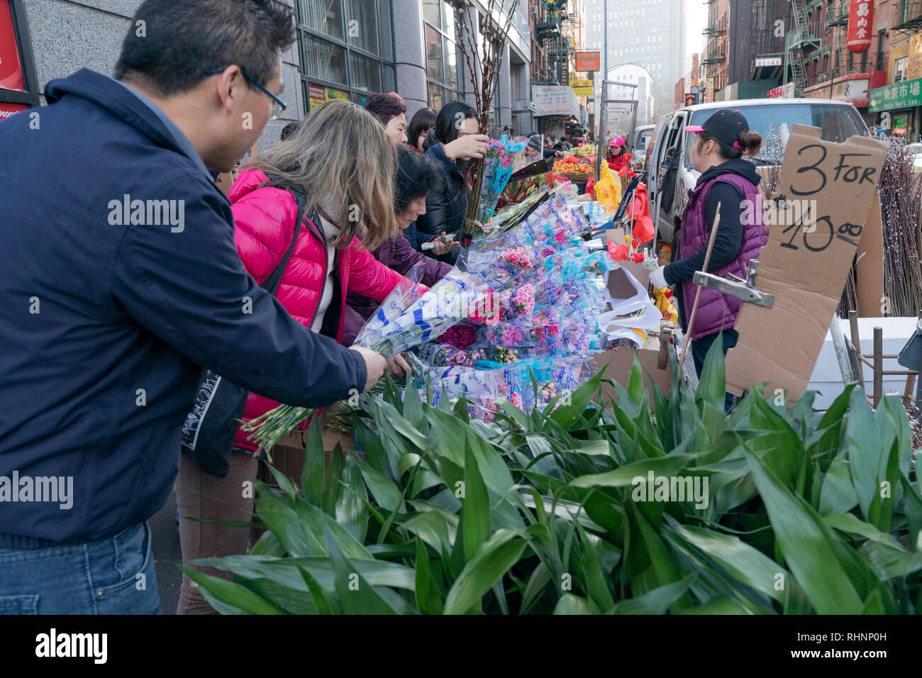 New York, NY - February 3, 2019: People rush to buy flowers in ...