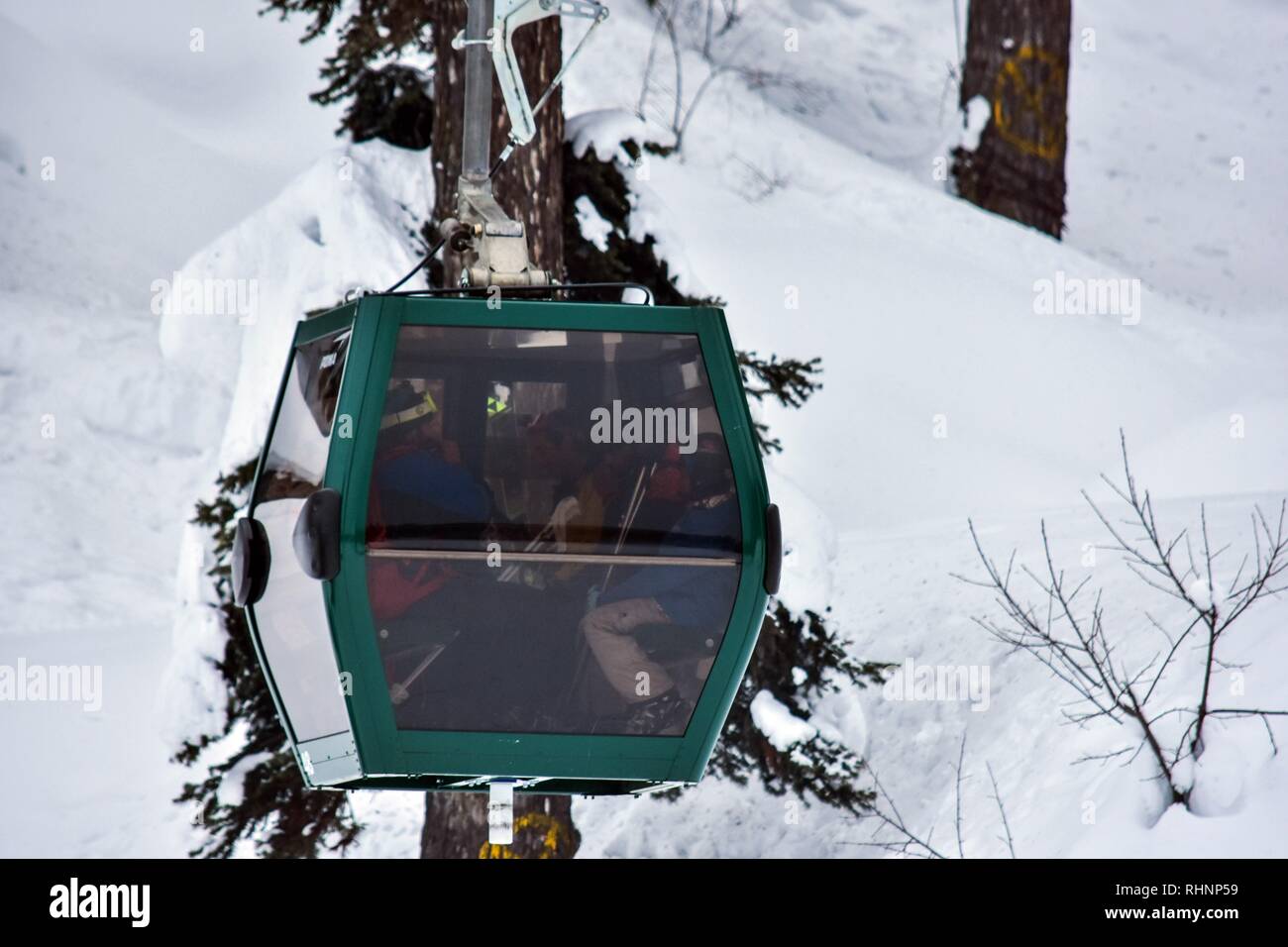 A cable car gondola seen carrying skiers at a famous ski resort in ...