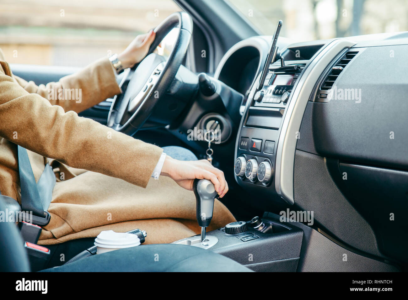 young woman hand on gear shift stick in car. road trip Stock Photo - Alamy