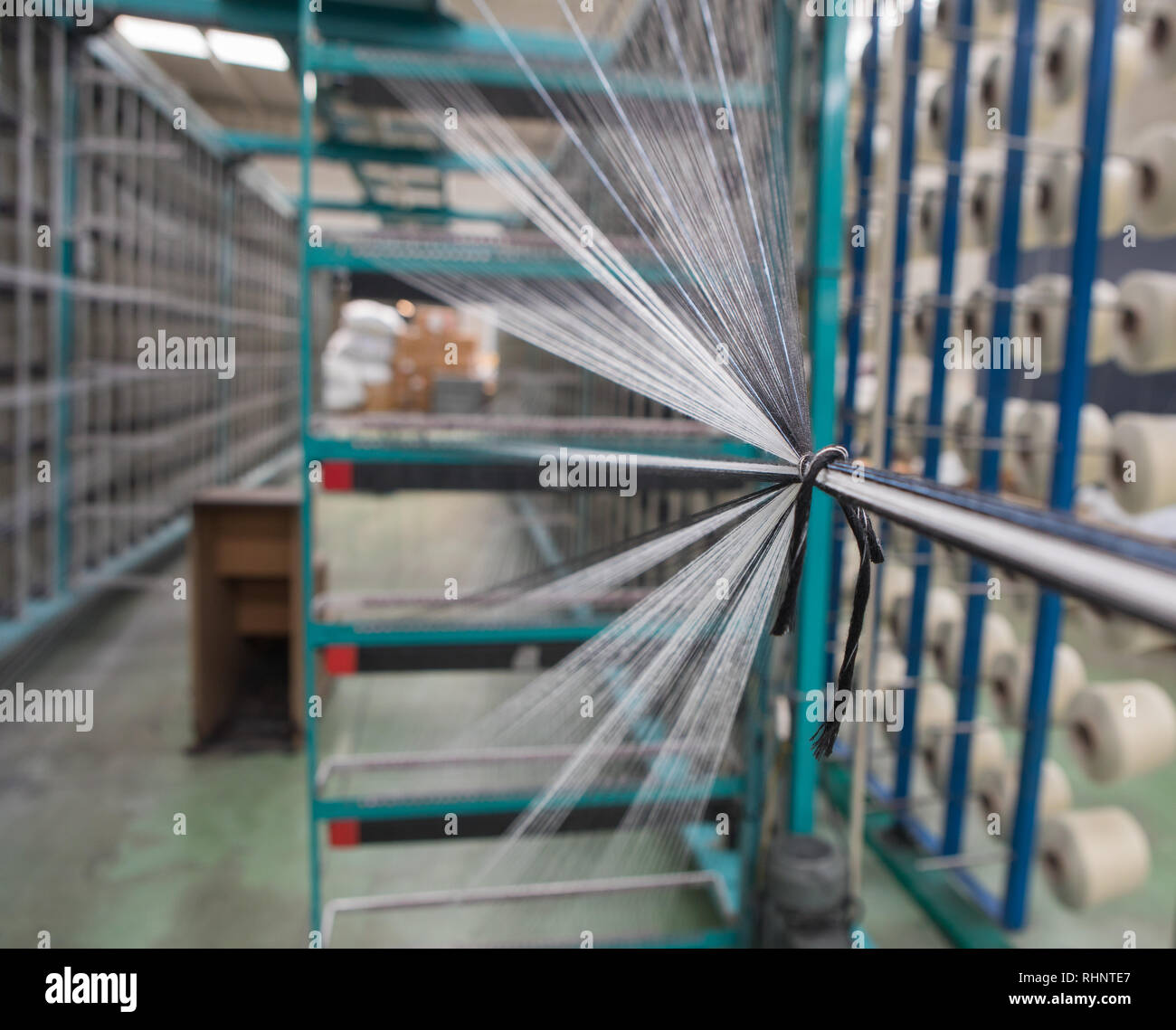 Close up macro detail of Yarn thread lines running in the weaving loom ...