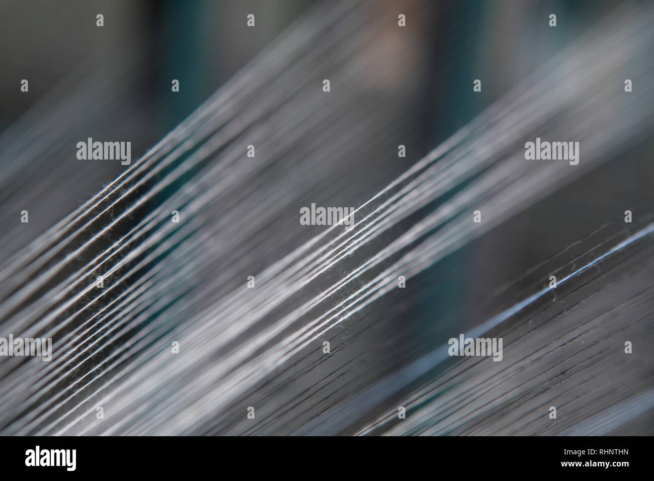 Close up macro detail of Yarn thread lines running in the weaving loom ...