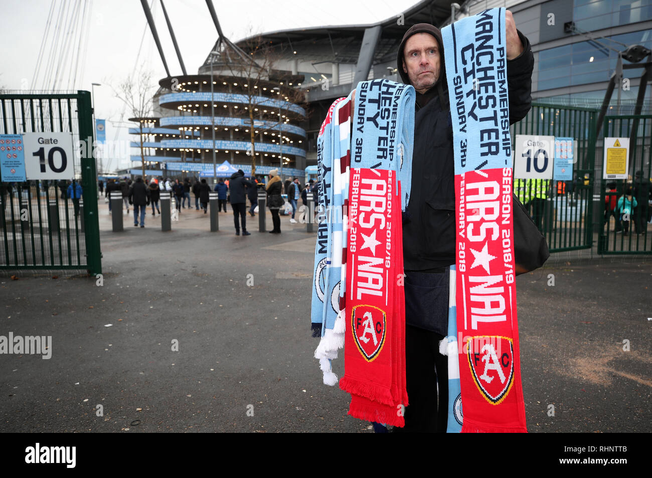 A vendor sells half and half scarves during the Premier League match at ...