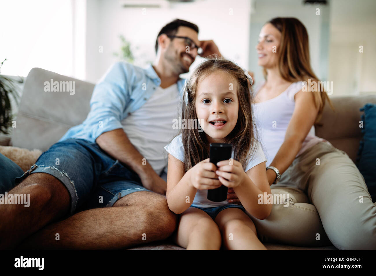 Happy family having fun time at home Stock Photo - Alamy