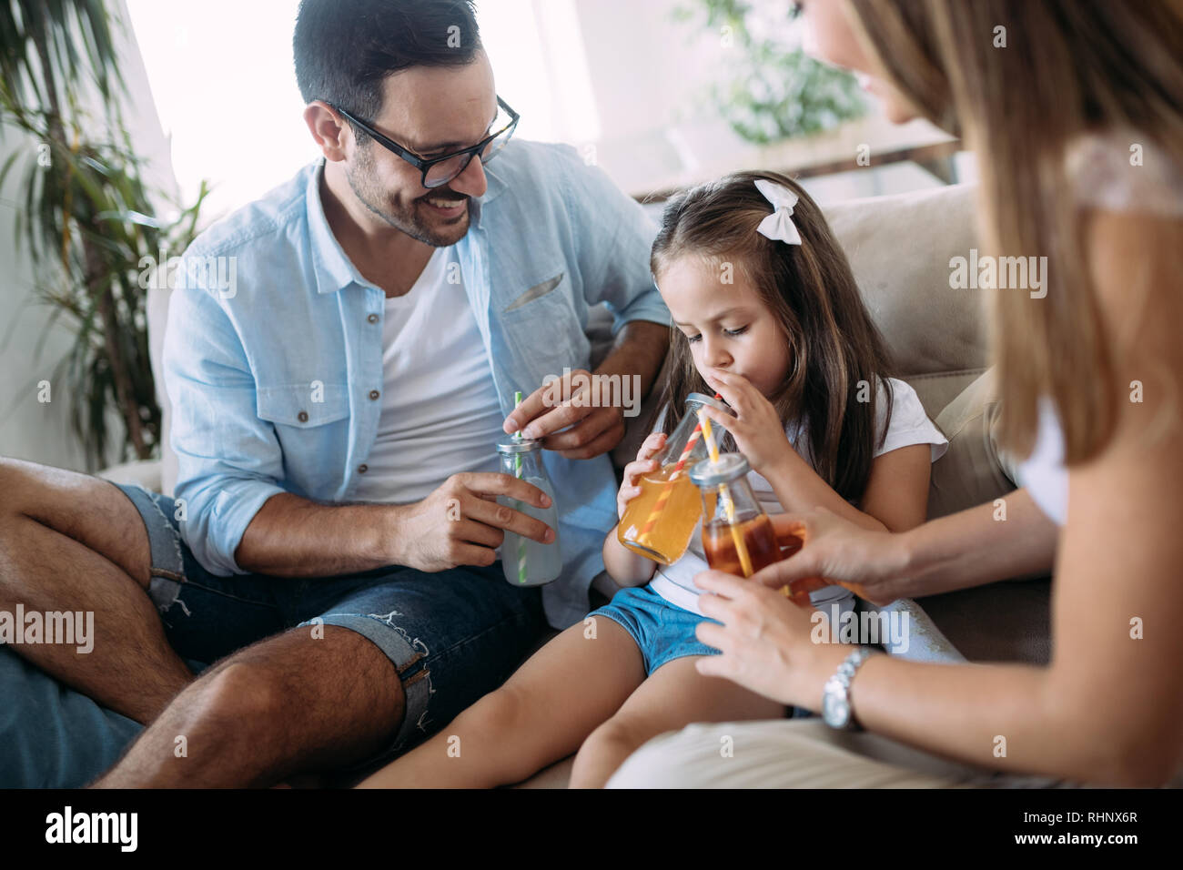 Happy family having fun time at home Stock Photo - Alamy