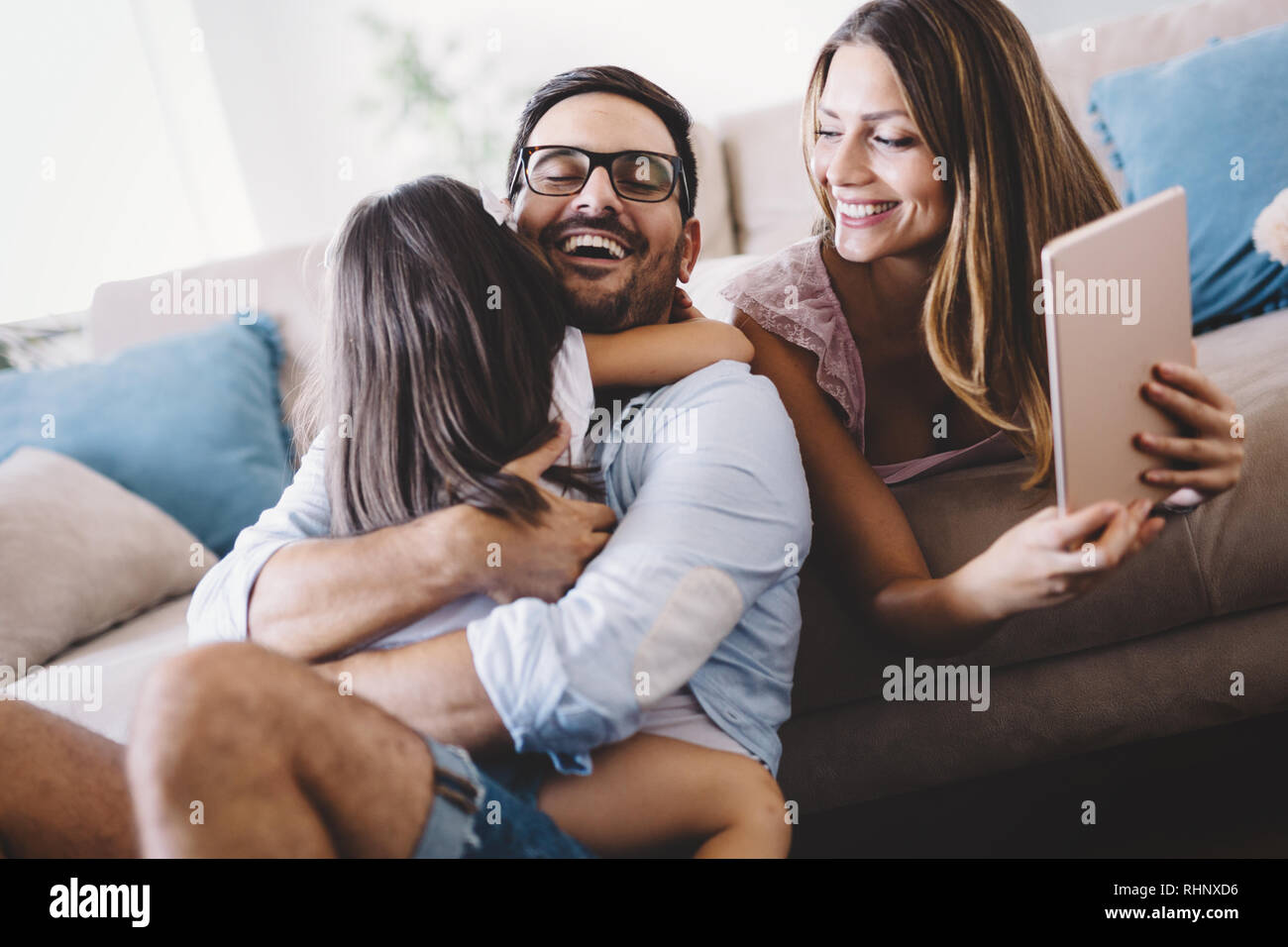 Happy family having fun time at home Stock Photo - Alamy