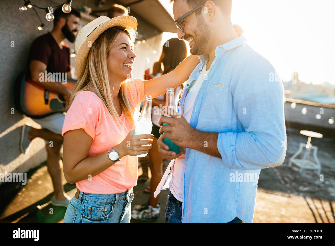 Happy couple having fun time at party Stock Photo - Alamy