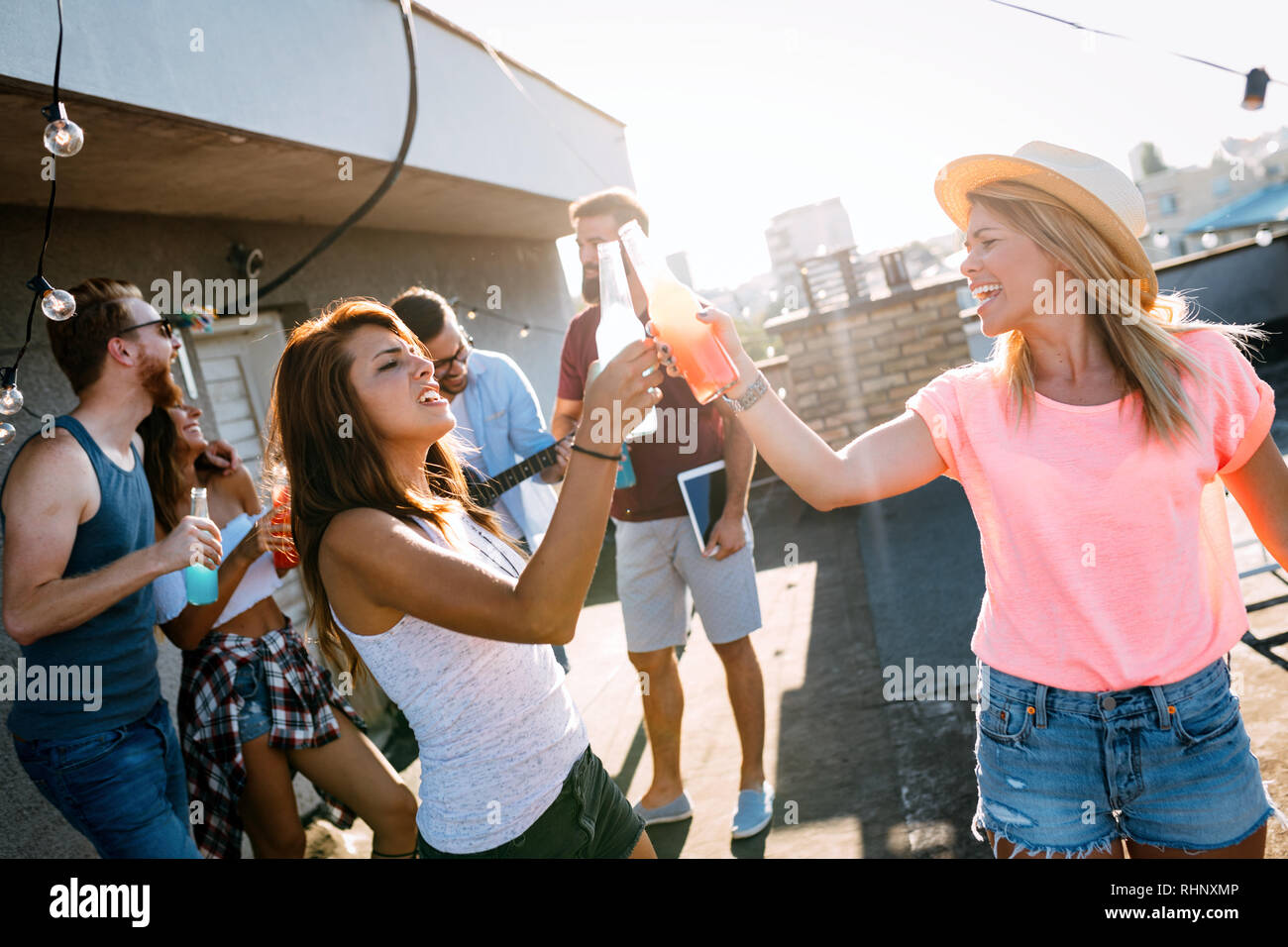 Happy young girls having fun at party Stock Photo - Alamy