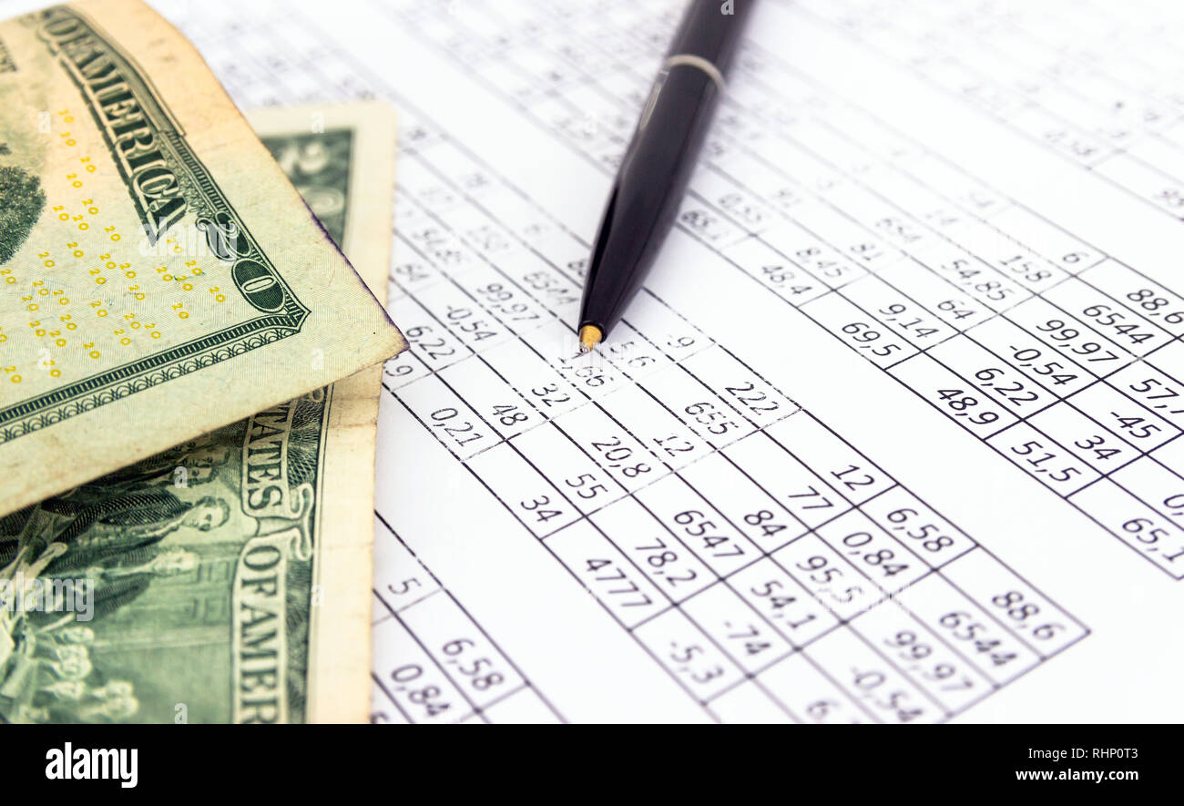 Money and pen, piece of paper with numbers, business concept. American ...