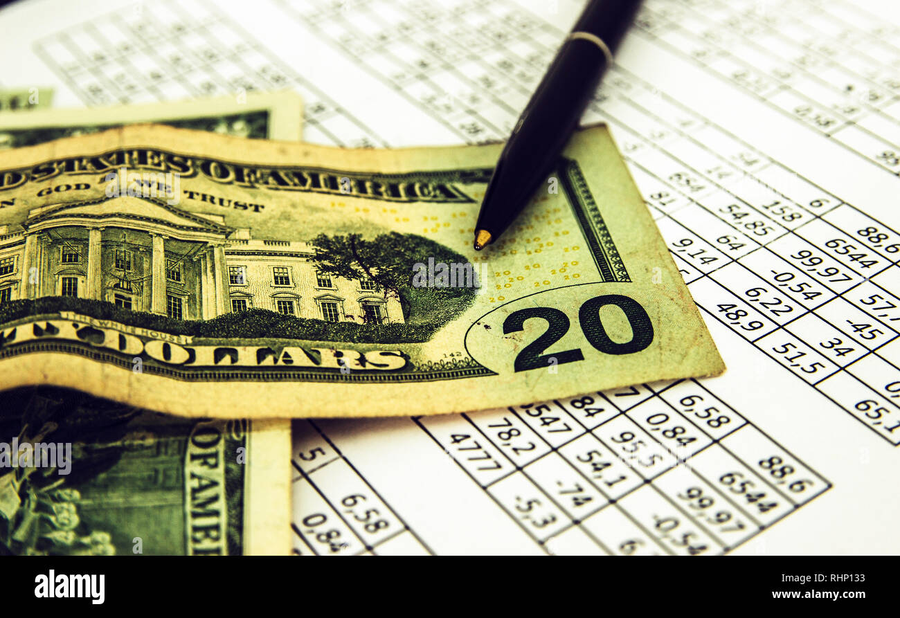 Money and pen, piece of paper with numbers, business concept. American ...