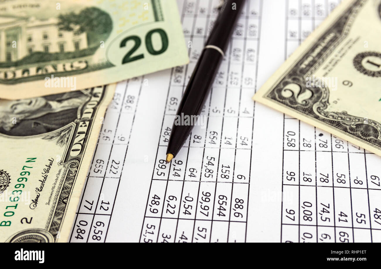 Money and pen, piece of paper with numbers, business concept. American ...