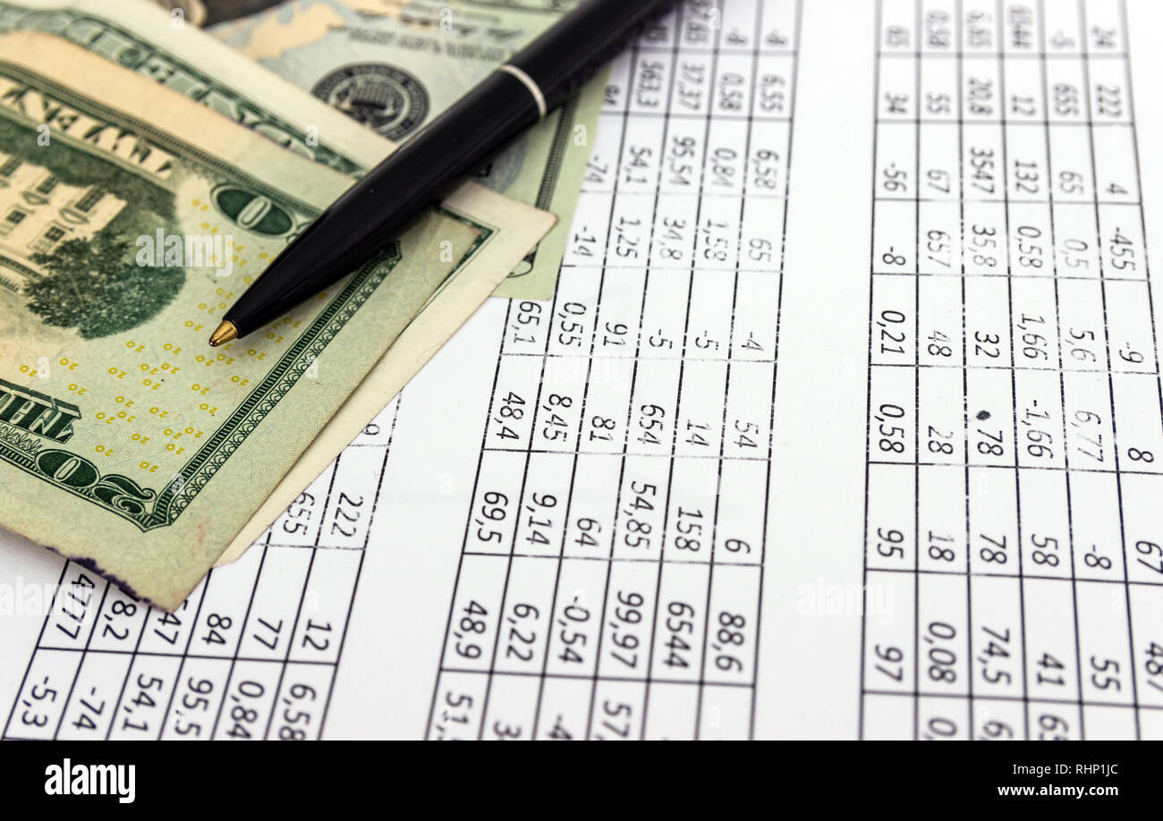 Money and pen, piece of paper with numbers, business concept. American ...
